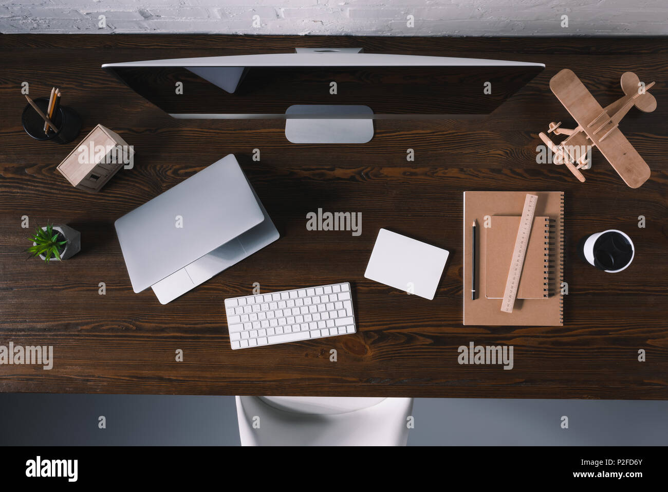 top view of desktop computer, laptop and office supplies at workplace ...