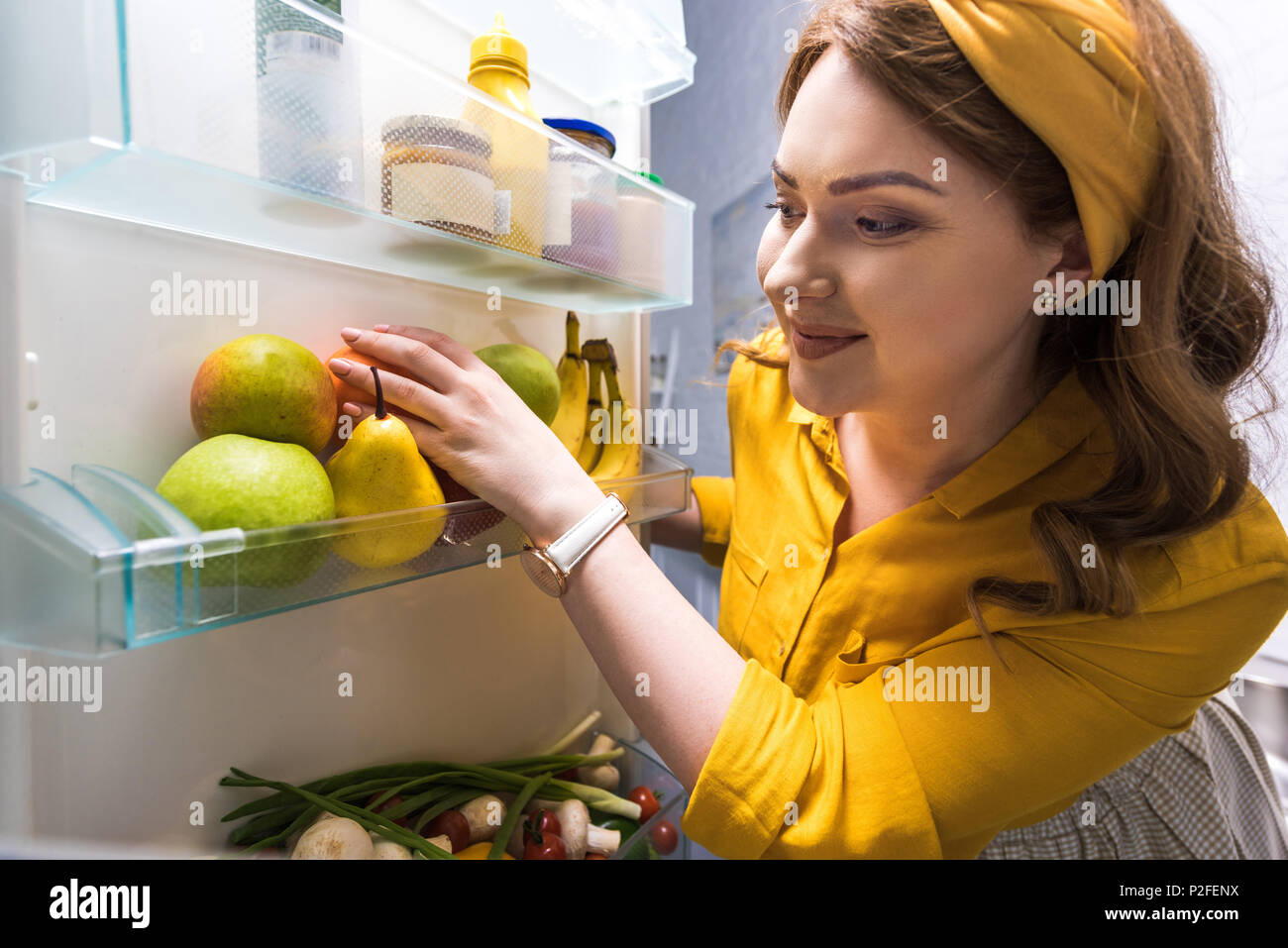 Taking vegetables from fridge hi-res stock photography and images - Alamy