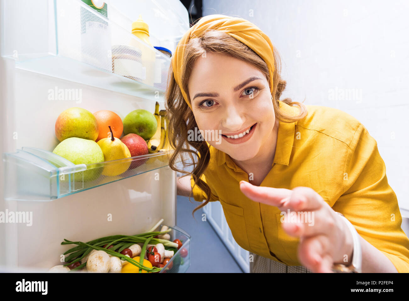 Reaching into fridge hi-res stock photography and images - Alamy
