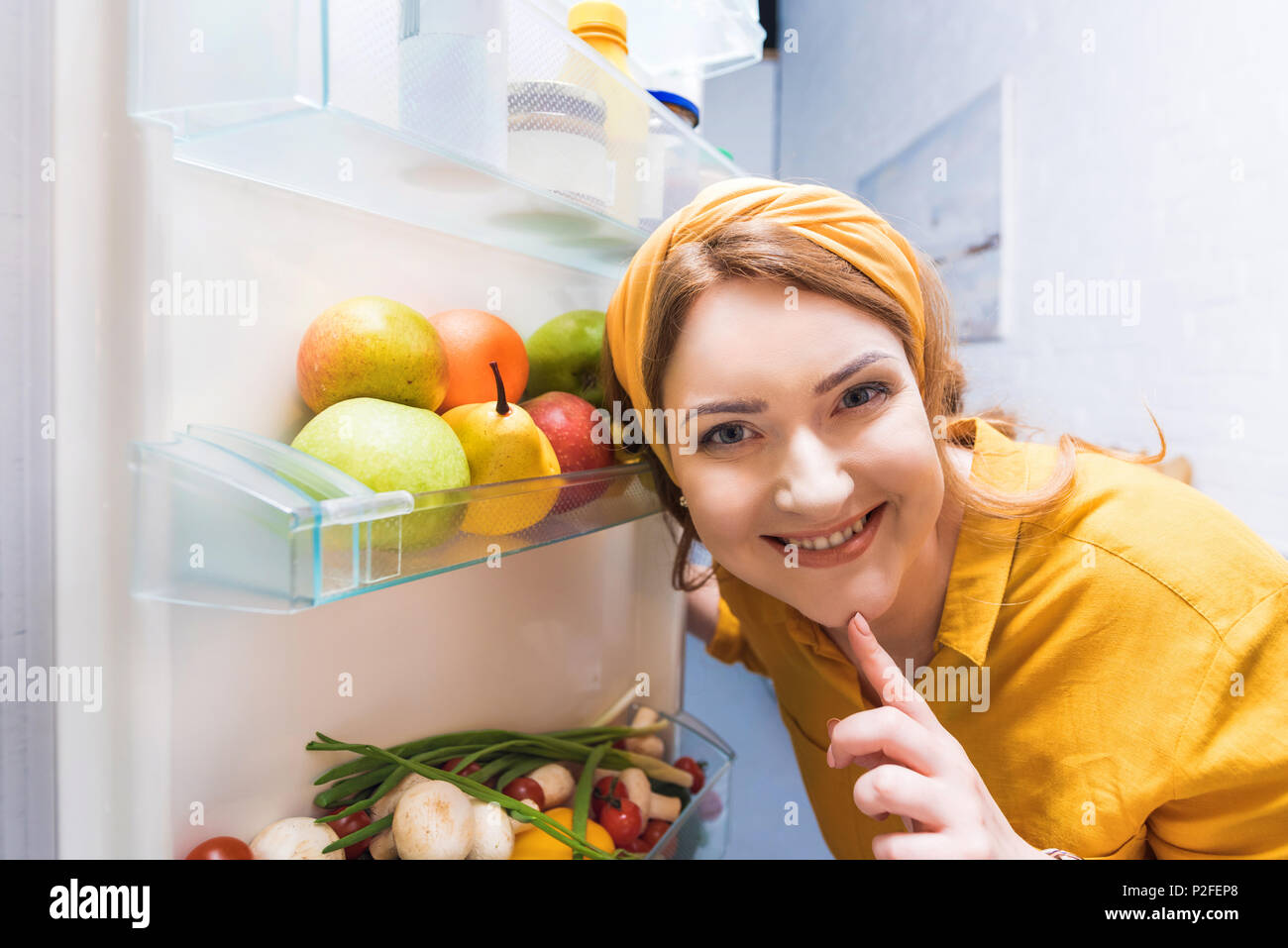 Beautiful woman opening fridge hi-res stock photography and images - Alamy
