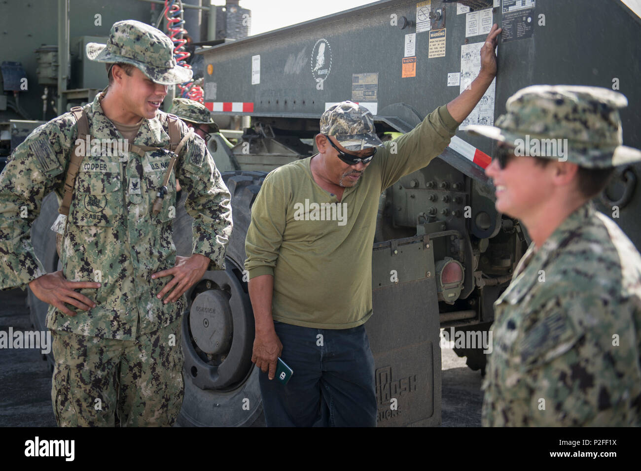 Equipment Operator 3rd Class Joseph Cooper (left) and Steelworker 2nd ...