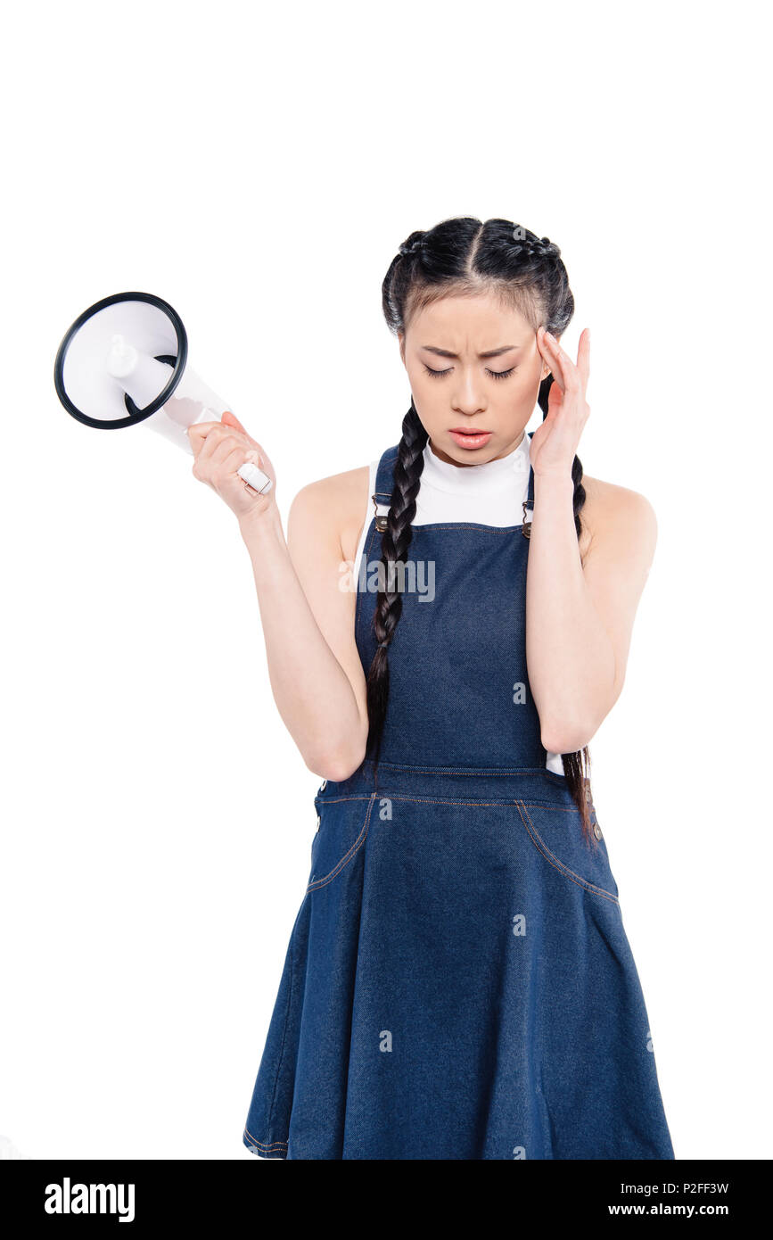 portrait of tired asian woman with loudspeaker isolated on white Stock ...