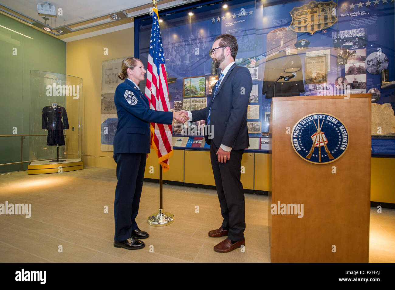 Chief Master Sgt. Beth Topa, 11th Wing command chief, receives the ...