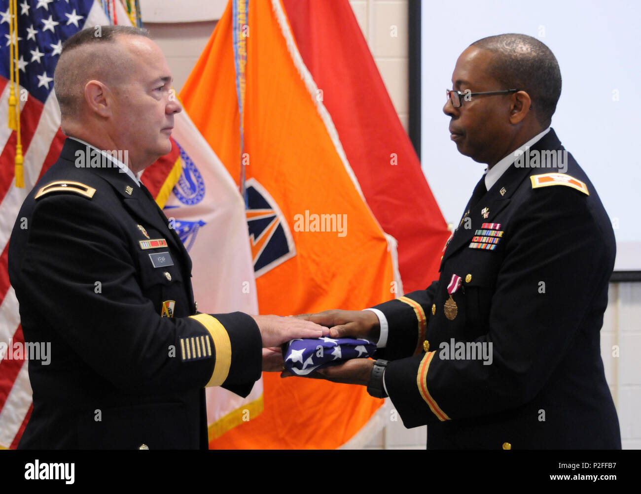 Army Brig. Gen. Christopher Kent passes the retirement flag to Col ...