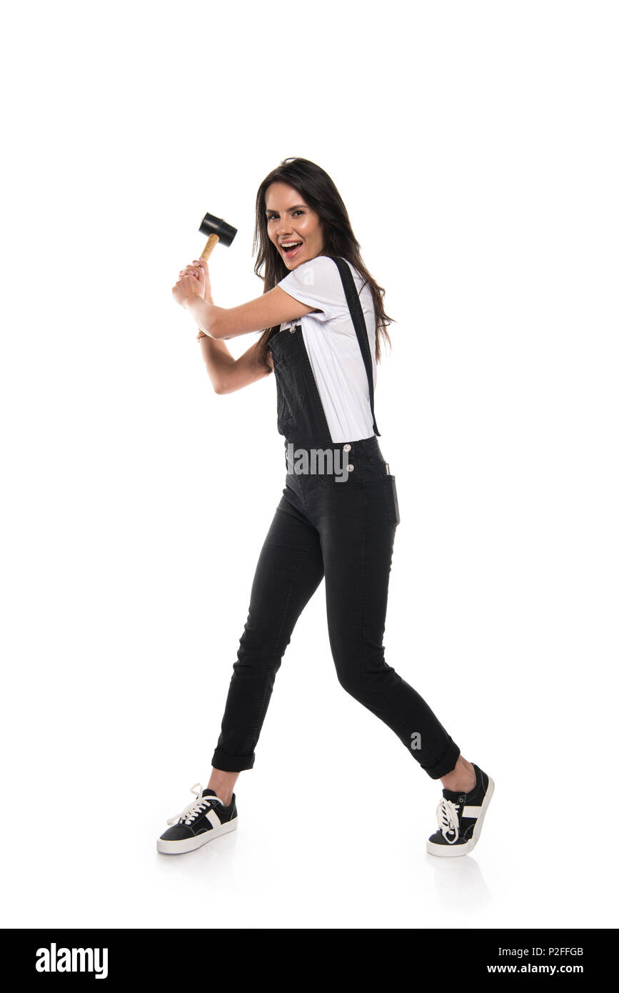 Emotional young woman holding hammer isolated on white Stock Photo - Alamy