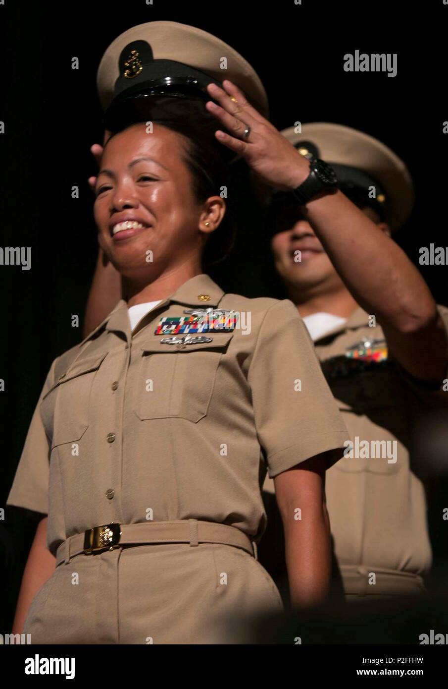 Chief Petty Officer Jeremy Regalia stands at the position of attention ...