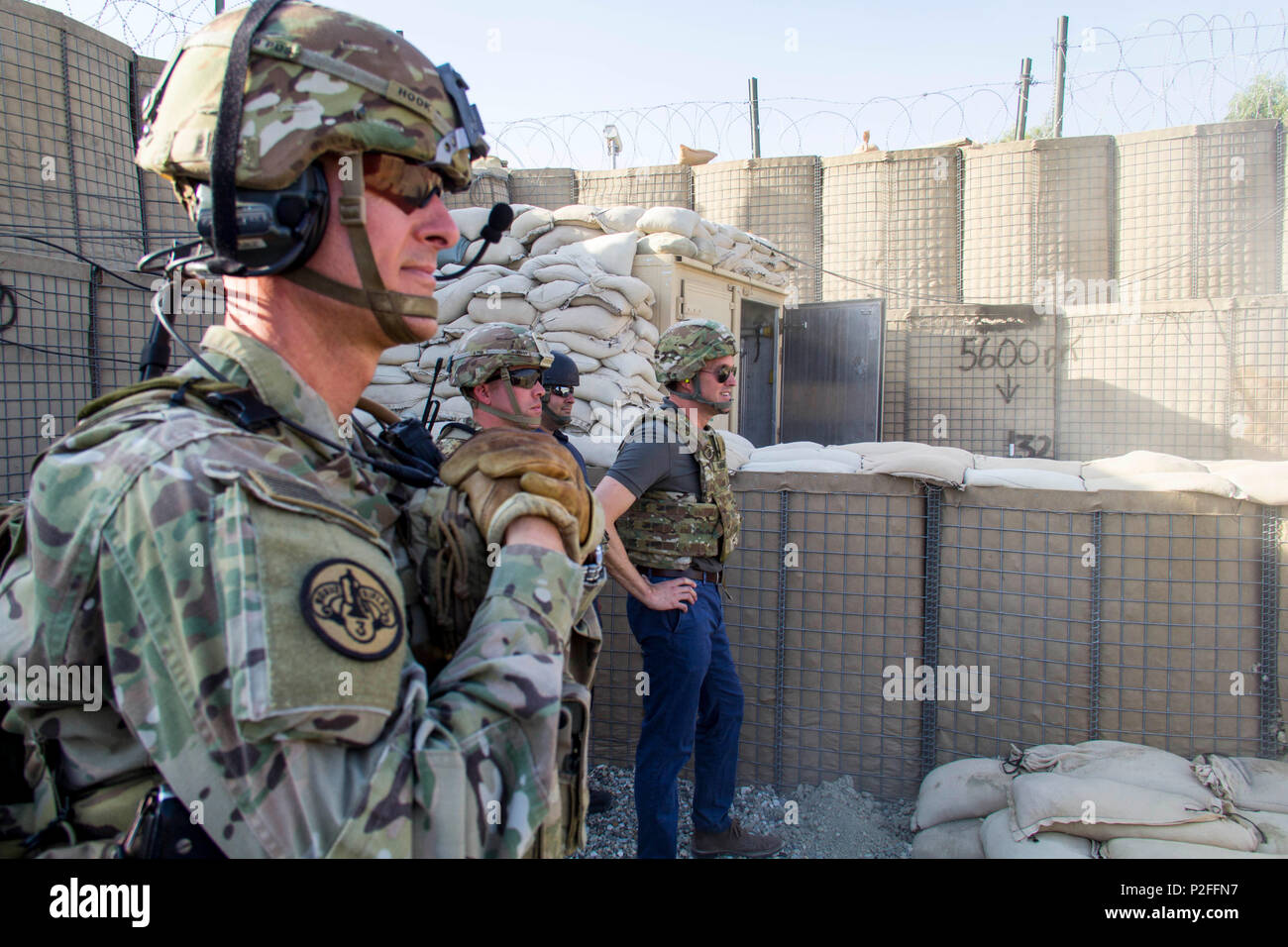 U.S. Army Lt. Col. Todd Hook, left, and Capt. Bryson Shipman observe a ...