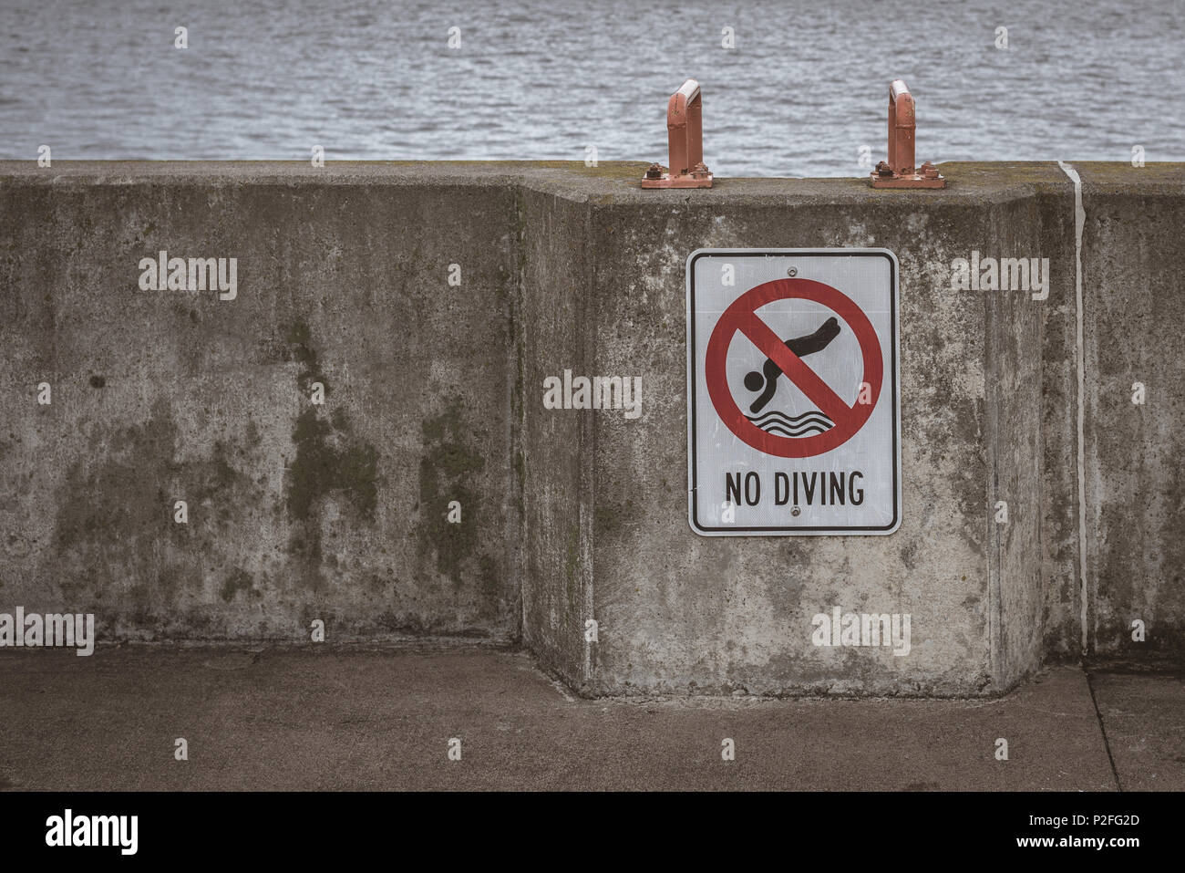 No Diving Sign on Pier Stock Photo - Alamy