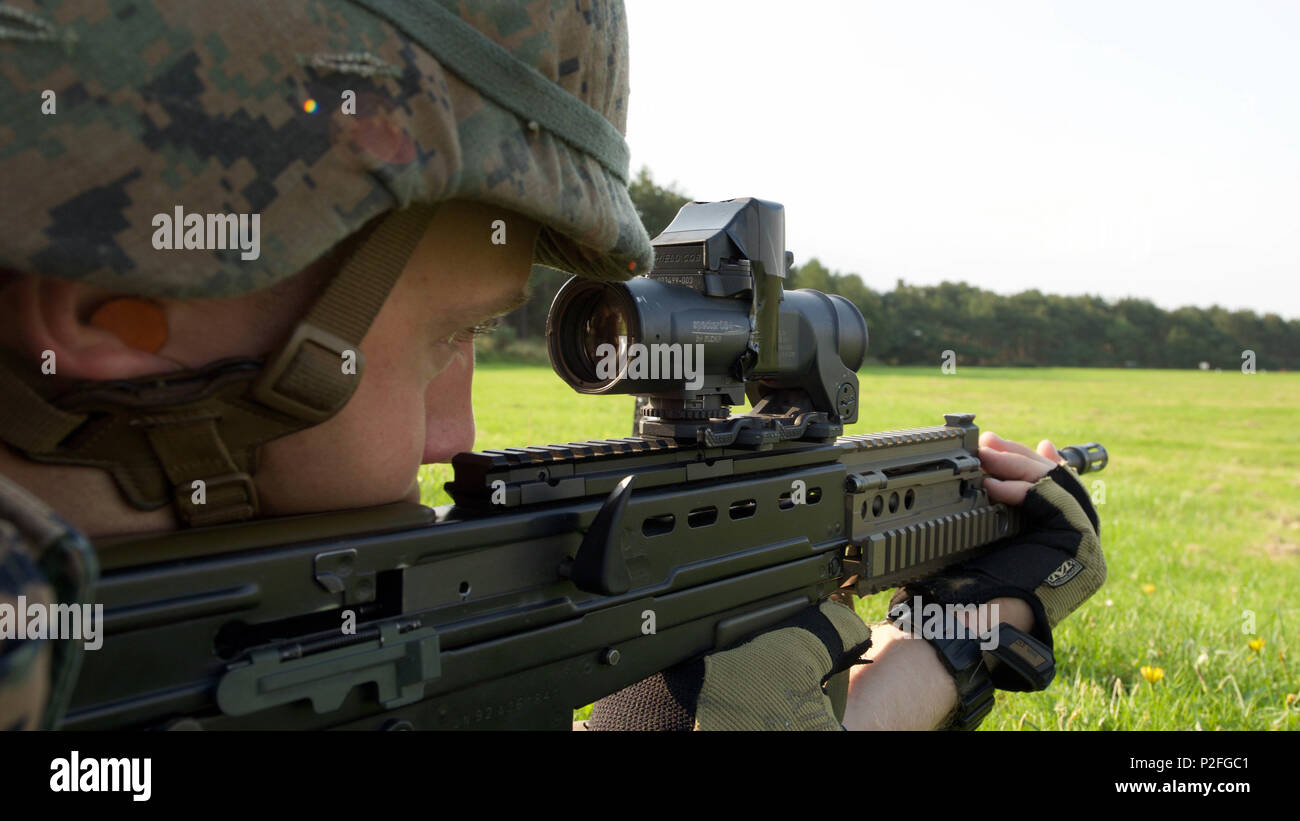 Capt. William Cunningham aims a SA80 A2 rifle, Sept. 13, 2016, at ...