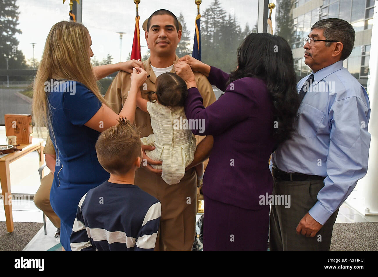 Chief Hospital Corpsman Alvaro Benitez Jr. has his anchors pinned on by ...
