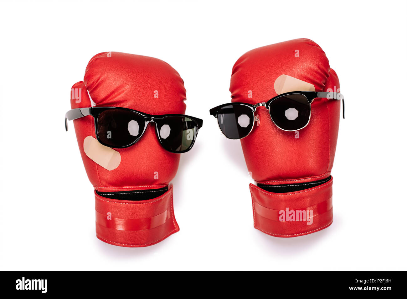 Pair of red boxing gloves in sunglasses making smiley composition ...