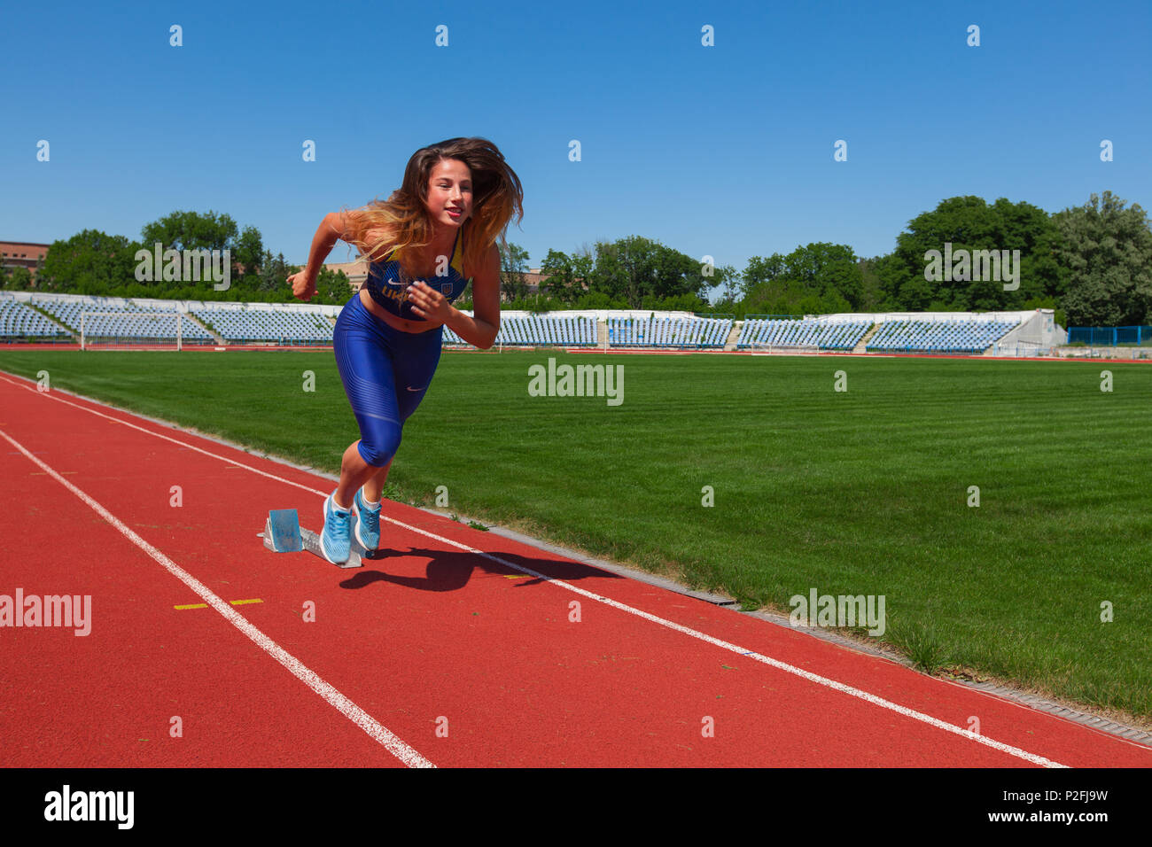 teenage girls doing sports at the stadium Stock Photo - Alamy