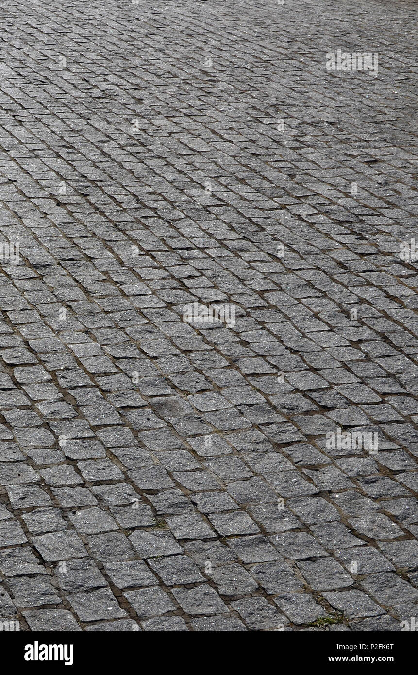 The texture of the paving slab (paving stones) of many small stones of ...