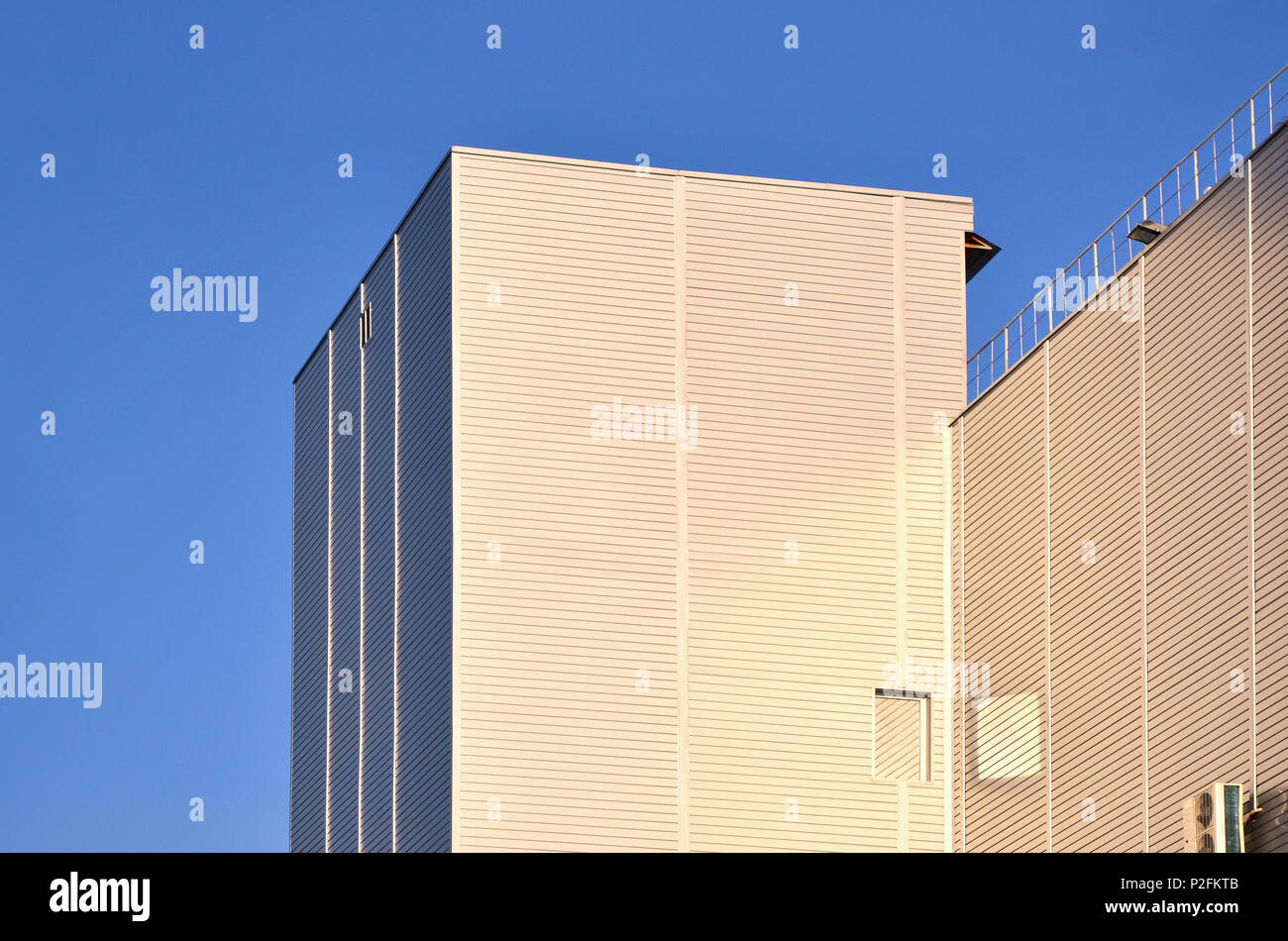 Photo of industrial high-rise building with perfect quality siding in ...