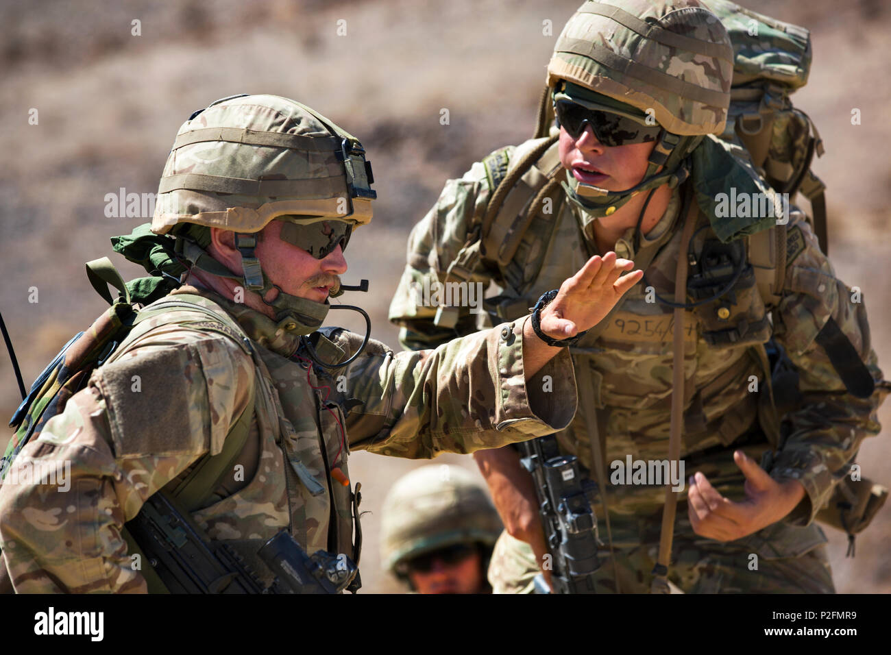 British Royal Marines discuss their scheme of maneuver during an ...