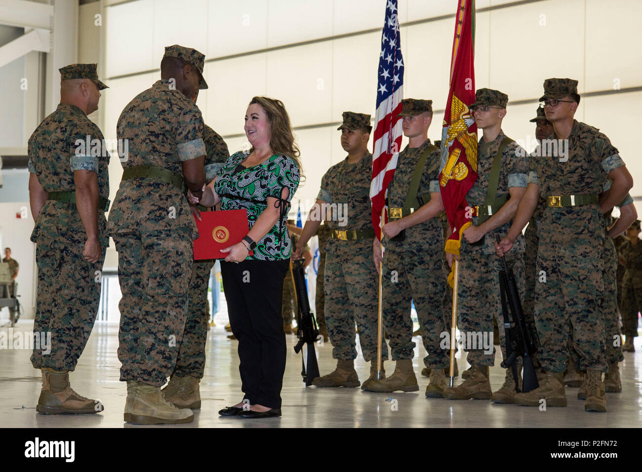 U.S. Marine Corps Lt. Col. Quentin Vaughn, center, commanding officer ...