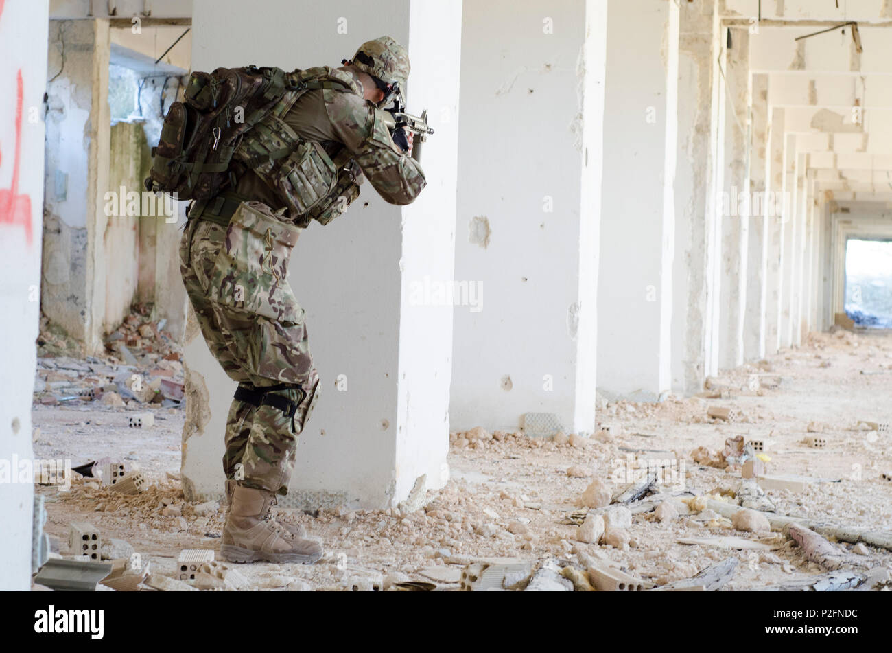 Special forces soldier inside building aim target rifle Stock Photo - Alamy