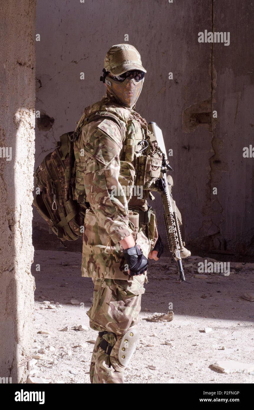Special forces soldier inside building aim target rifle Stock Photo - Alamy