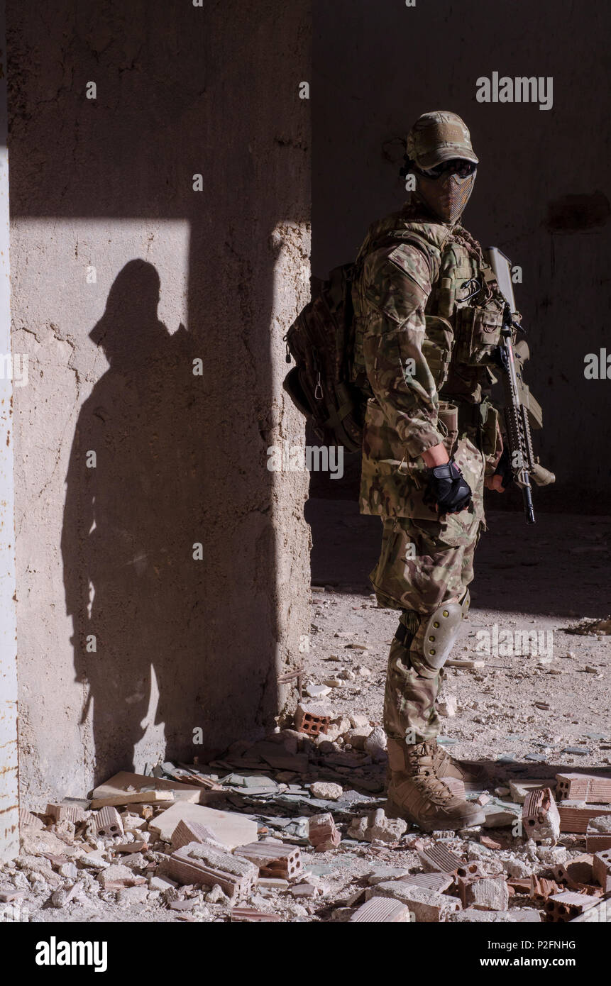 Soldier stand up keep rifle on hand Stock Photo - Alamy