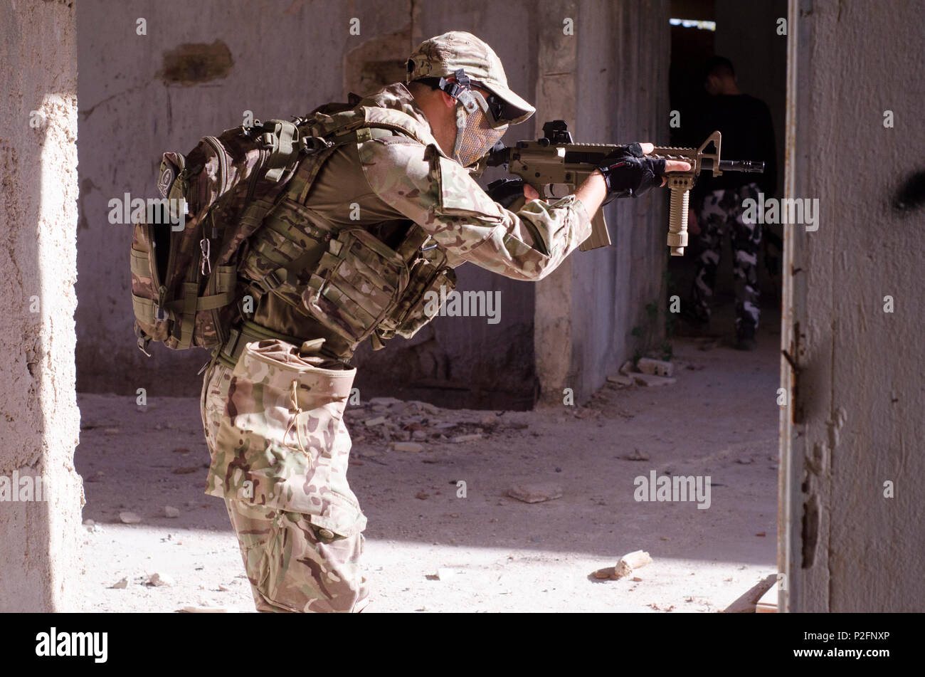 Special forces soldier inside building aim target rifle Stock Photo - Alamy