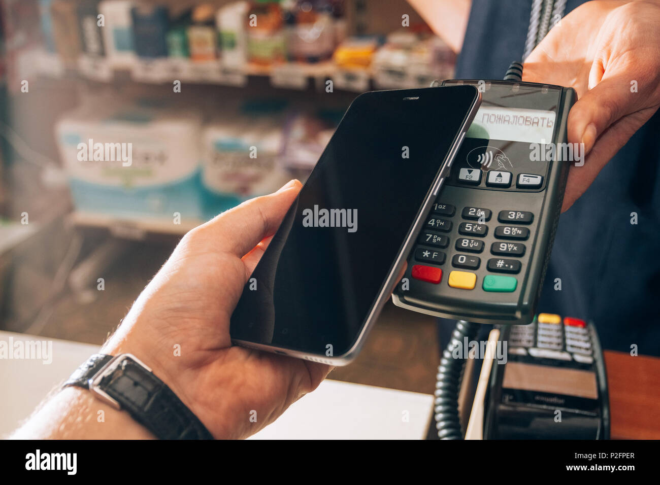 Worker holding payment terminal hi-res stock photography and images - Alamy