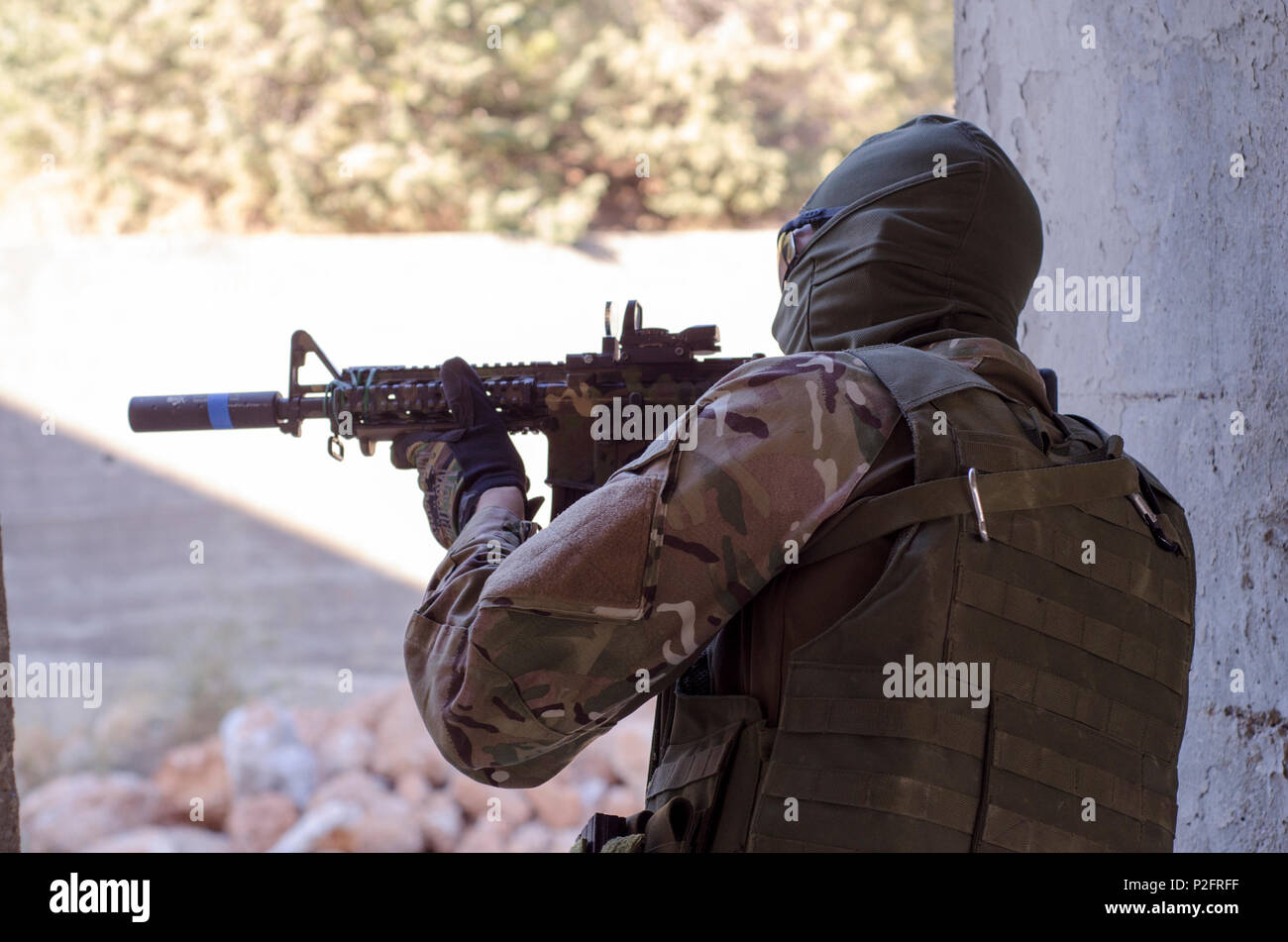 Full face soldier rifle keep on hands Stock Photo - Alamy