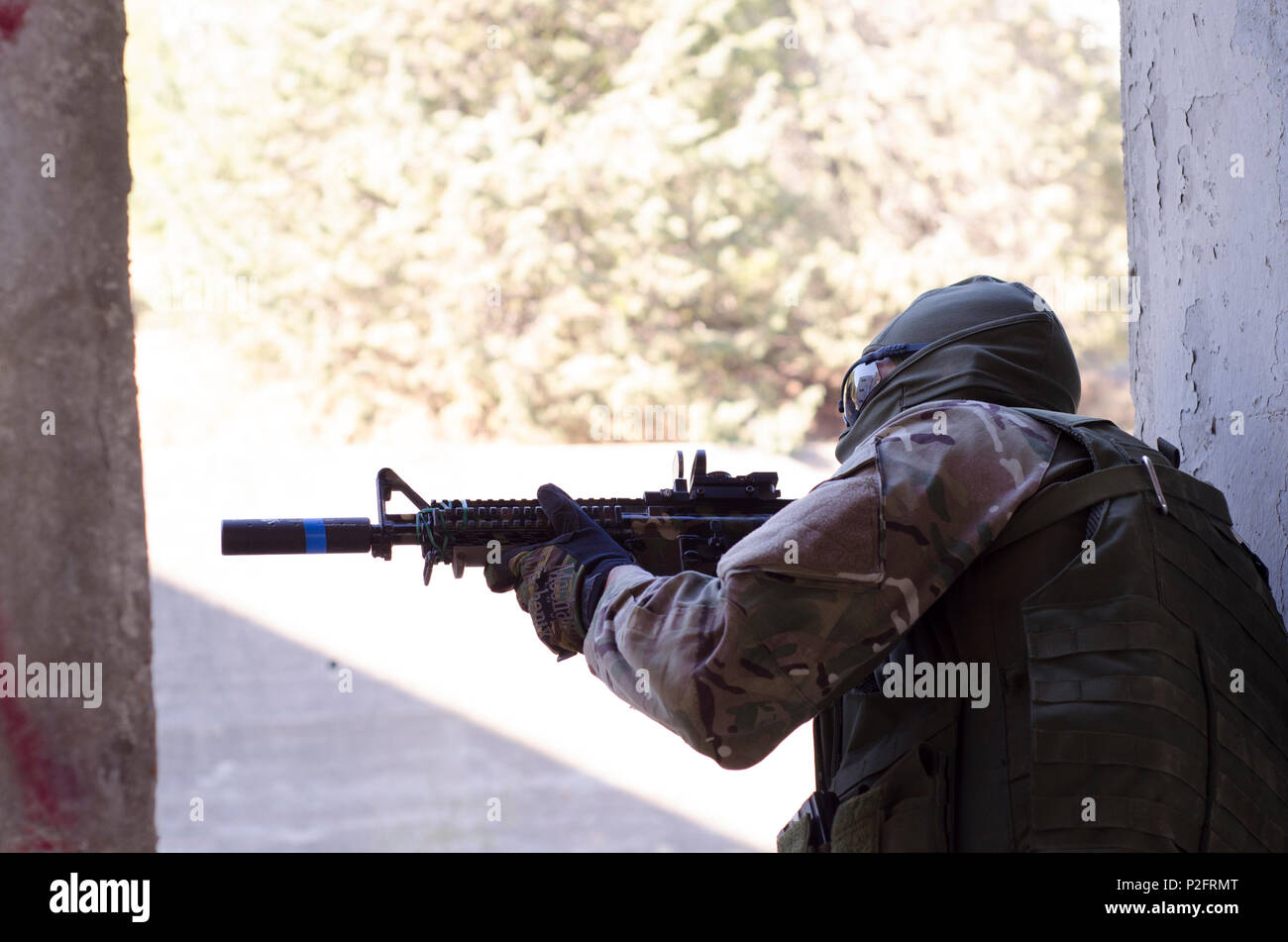 Full face soldier rifle keep on hands Stock Photo - Alamy