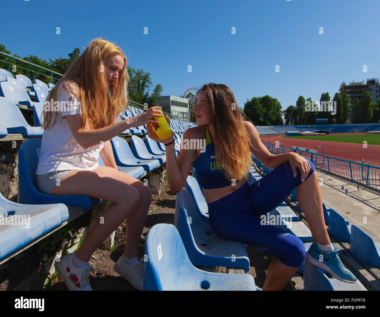 teenage girls doing sports at the stadium Stock Photo - Alamy