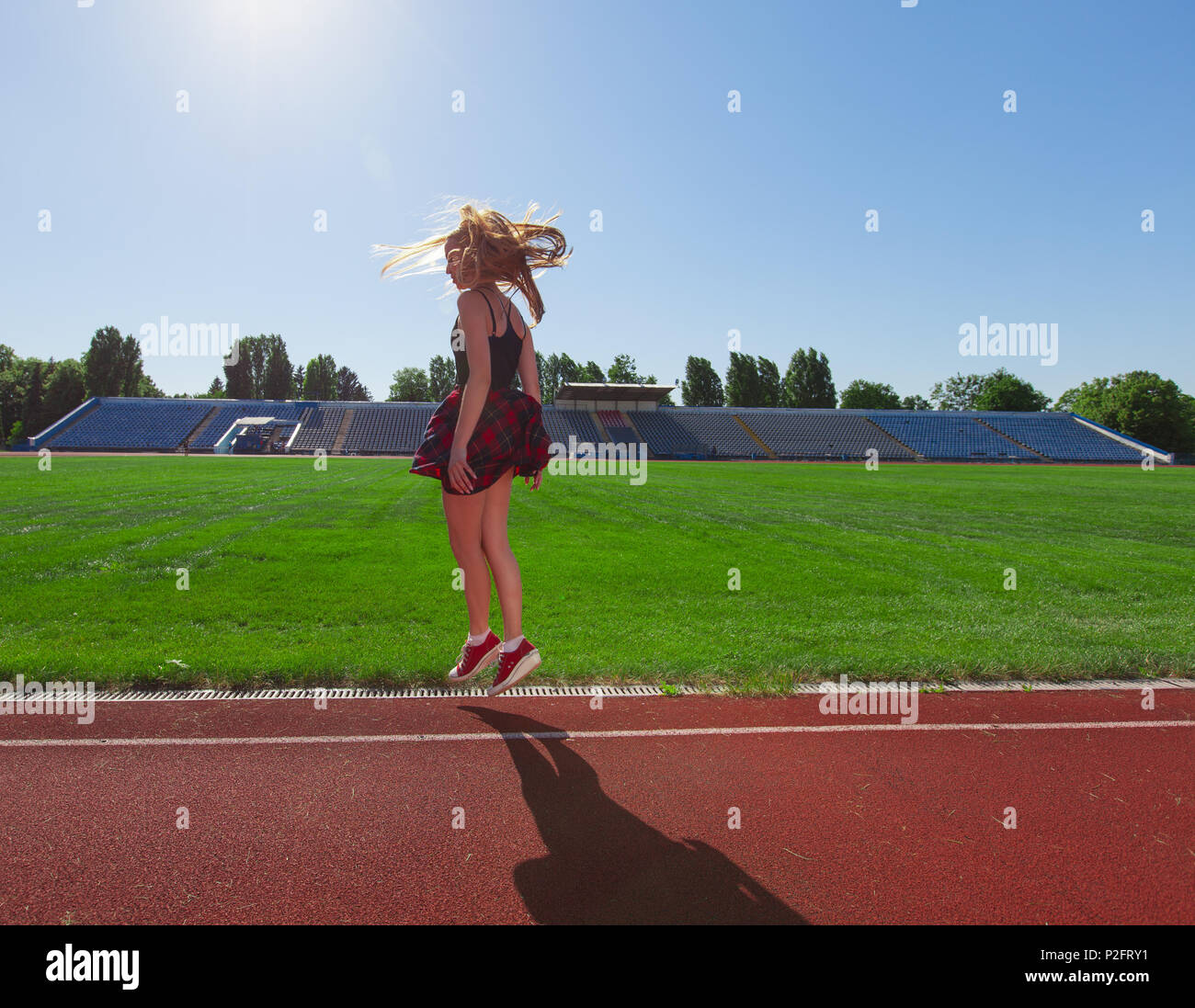 teenage girls doing sports at the stadium Stock Photo - Alamy