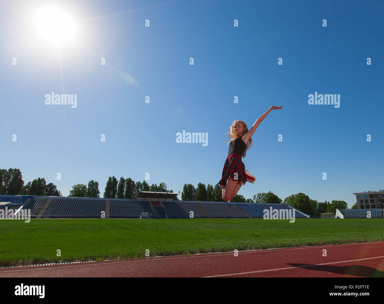 teenage girls doing sports at the stadium Stock Photo - Alamy