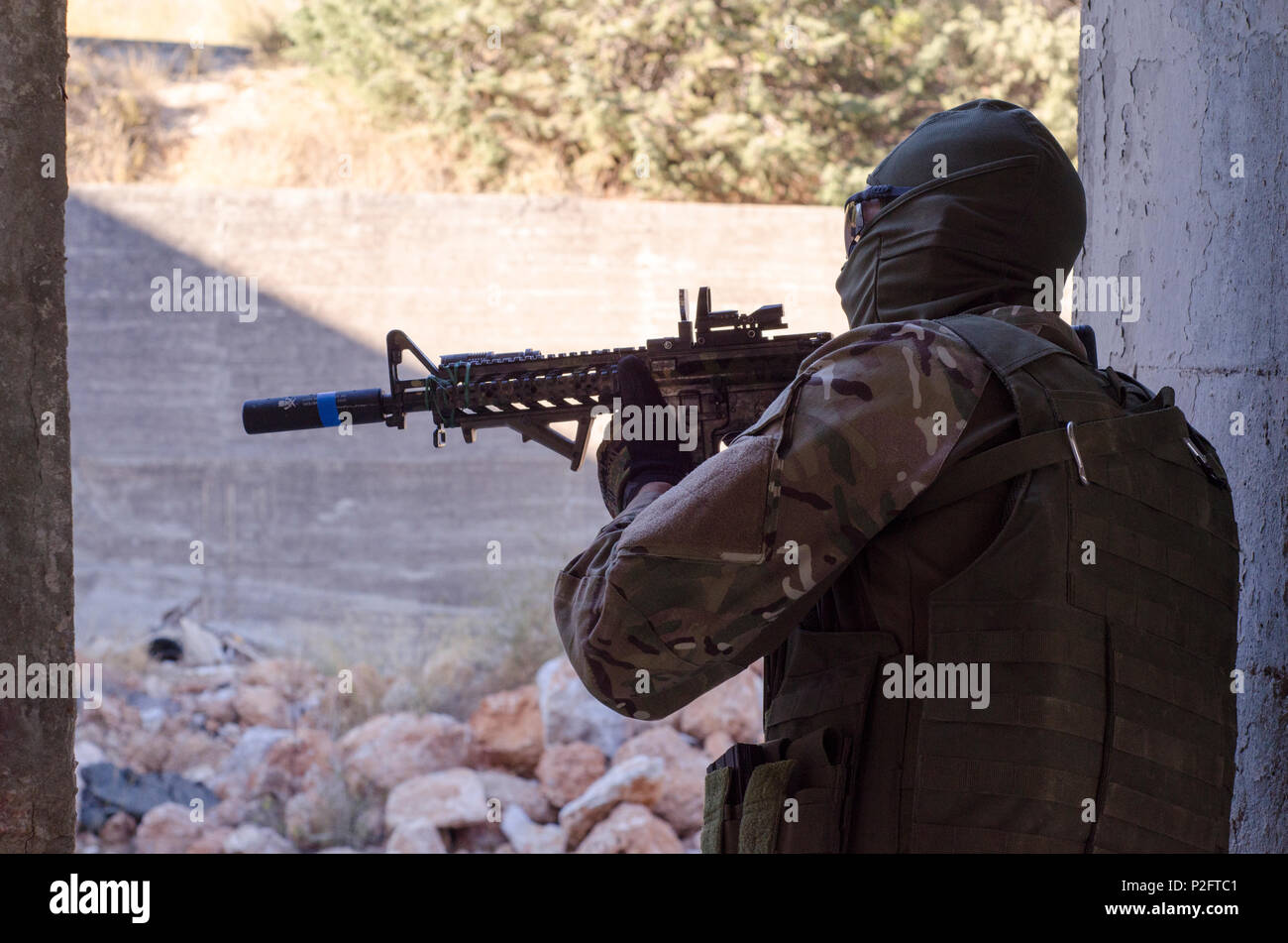 Full face soldier rifle keep on hands Stock Photo - Alamy