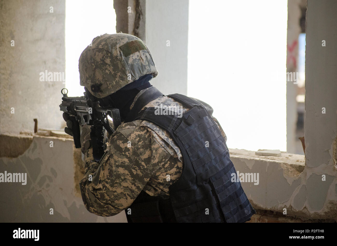 Airsoft soldier back view when aim target Stock Photo - Alamy