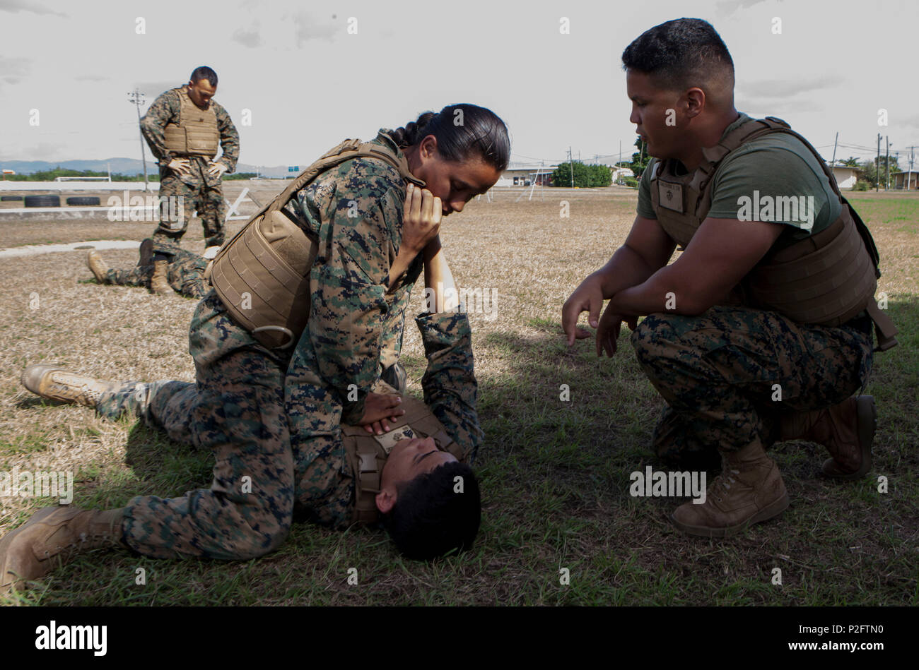 U.S. Marine Sgt. Mario Caraballo gives advice to Cpl. Elisabel ...