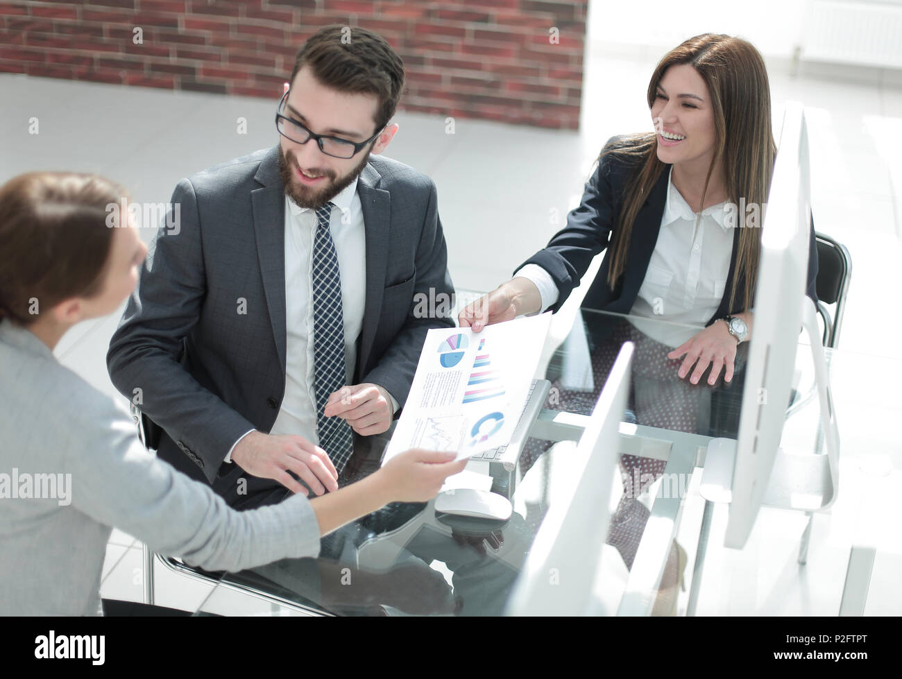 assistant passes business woman working document Stock Photo - Alamy