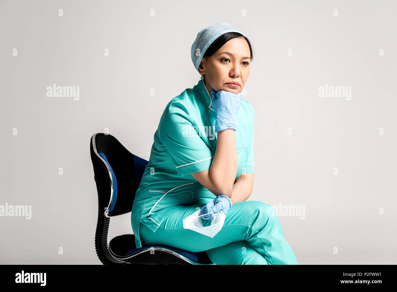 Doctor sitting on chair hi-res stock photography and images - Alamy