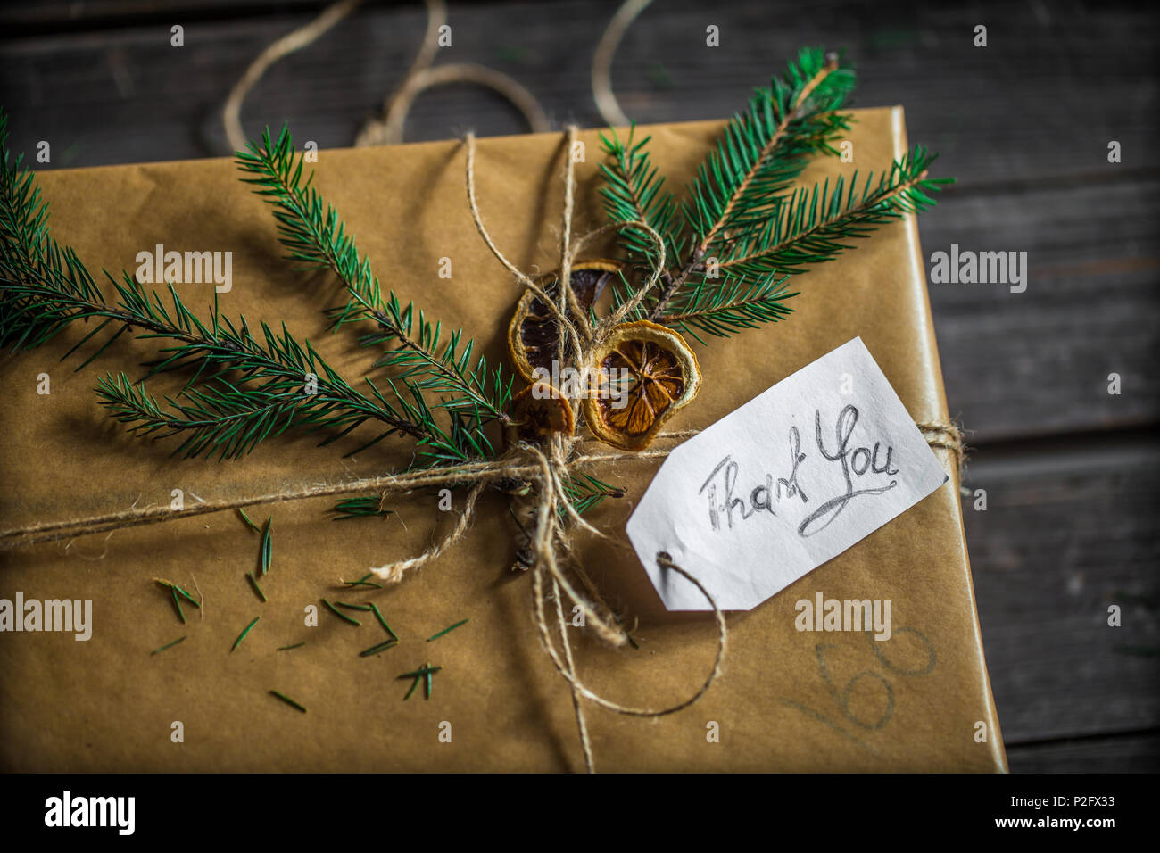 Packed box, beautifully wrapped gift on a wooden background with the ...