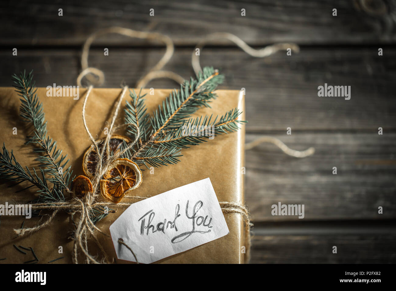 Packed box, beautifully wrapped gift on a wooden background with the ...