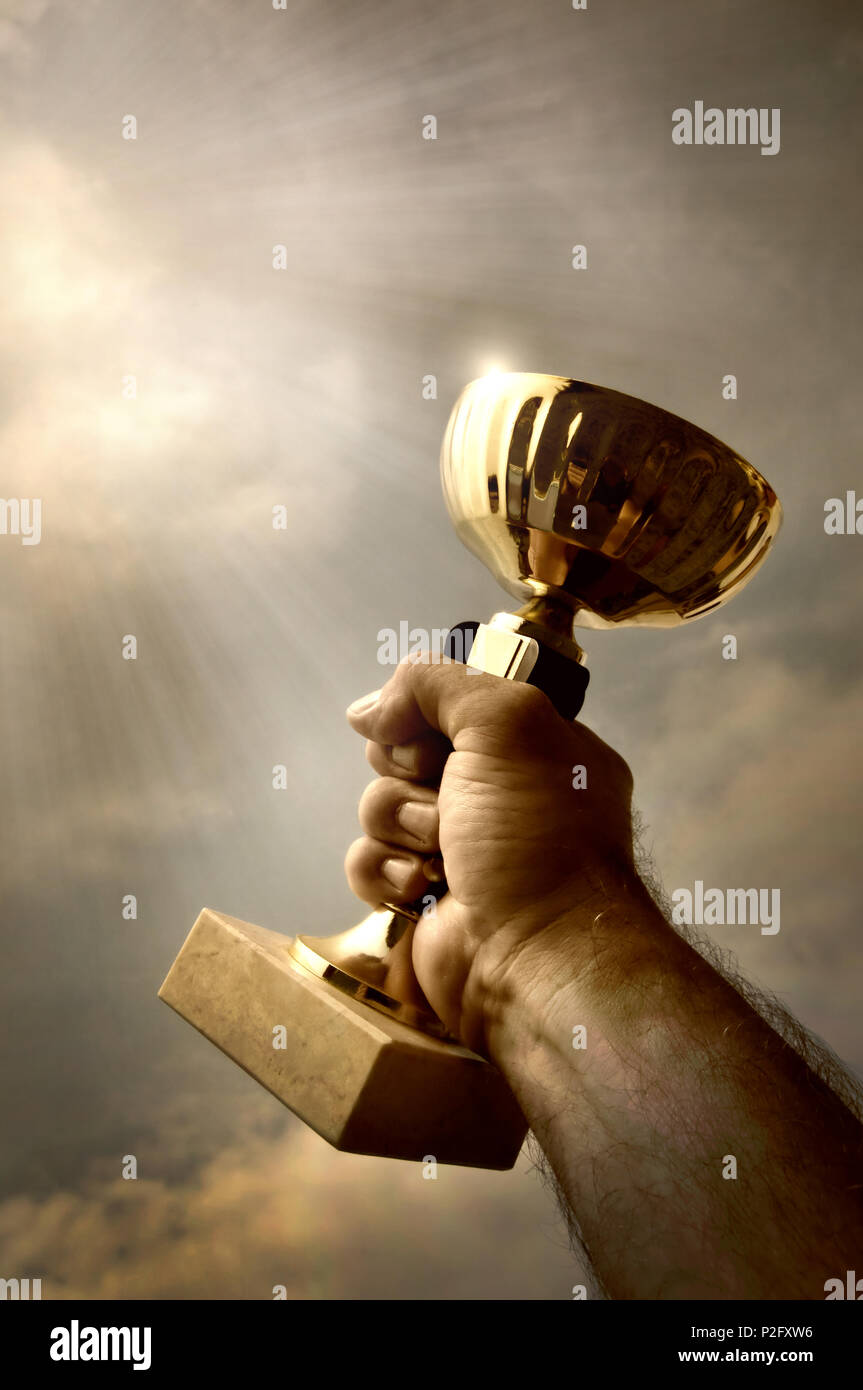 Winner with trophy Stock Photo - Alamy