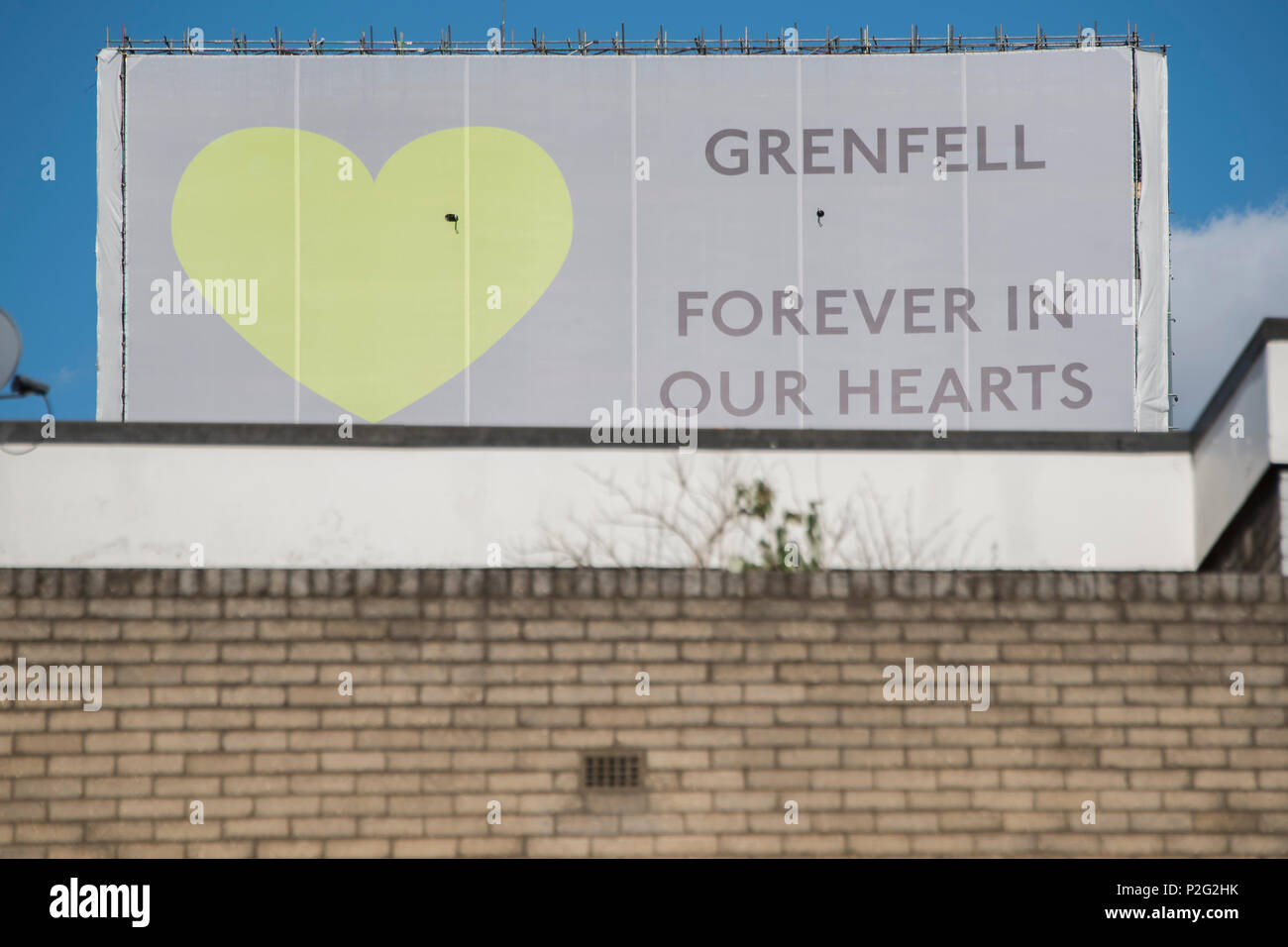 London, UK. 14th June 2018. The cladding on the tower - The first ...