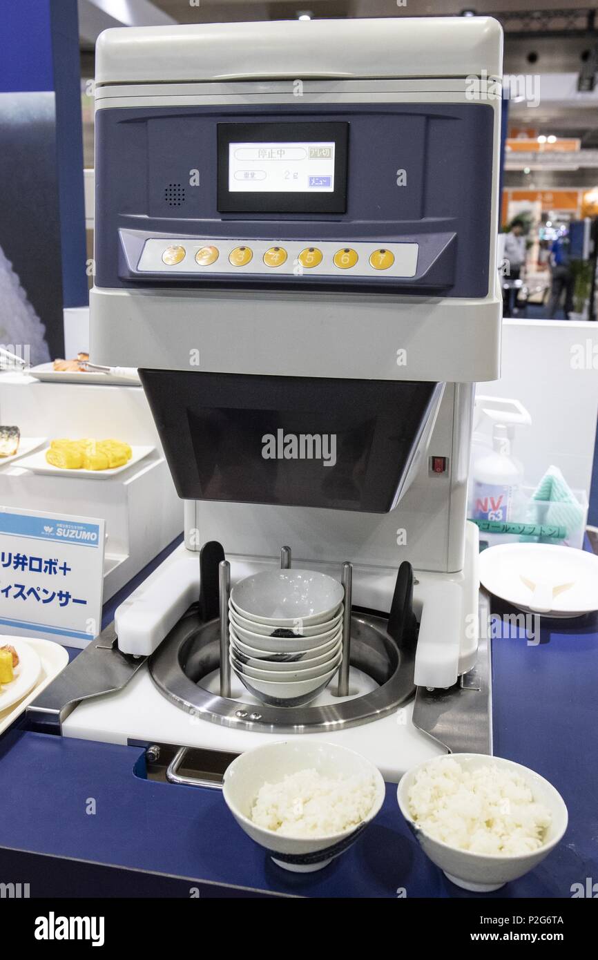 Tokyo, Japan. 15th June, 2018. A rice ball making machine produced by ...