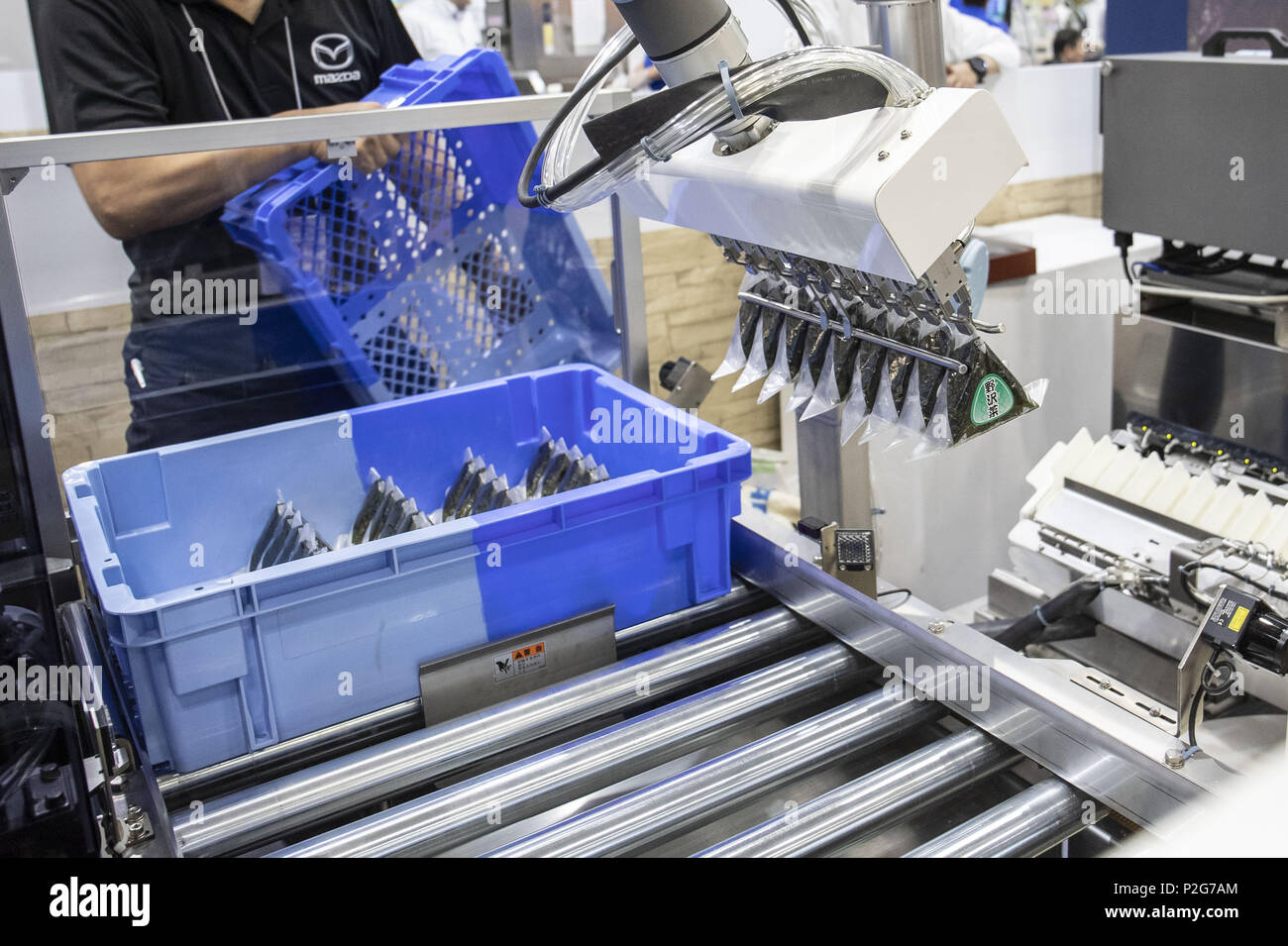 Tokyo, Japan. 15th June, 2018. Food processing machinery on display ...