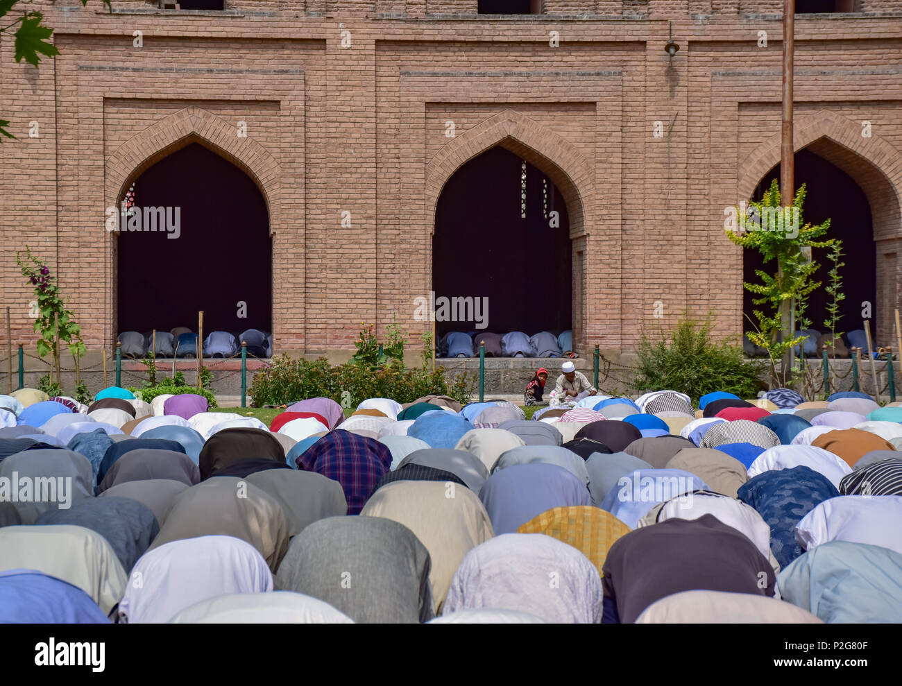 Kashmiri Muslims pray outside the Jamia Masjid or grand mosque on the ...