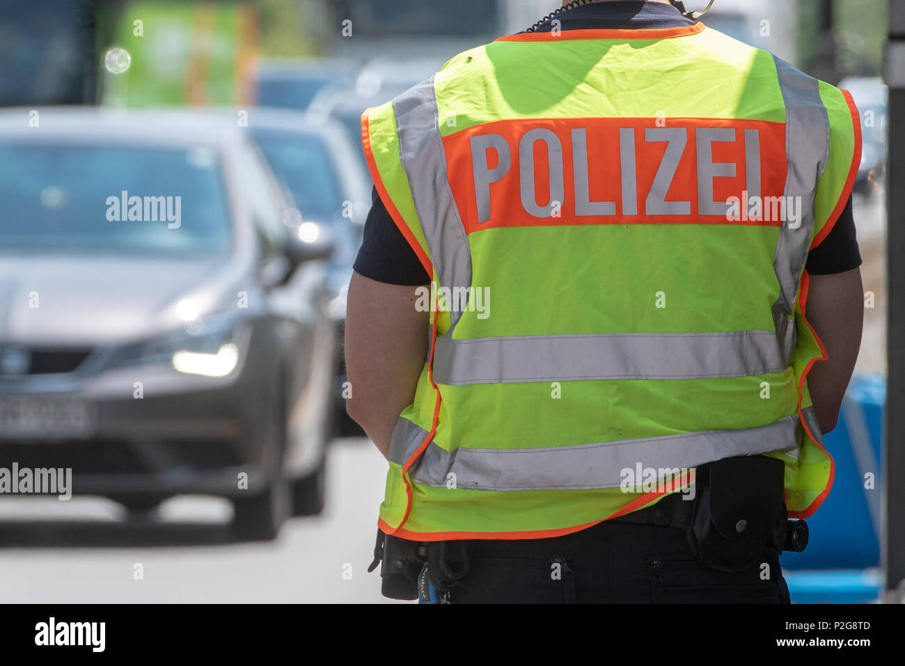 15 June 2018, Germany, Pocking: A German police officer stands at a ...