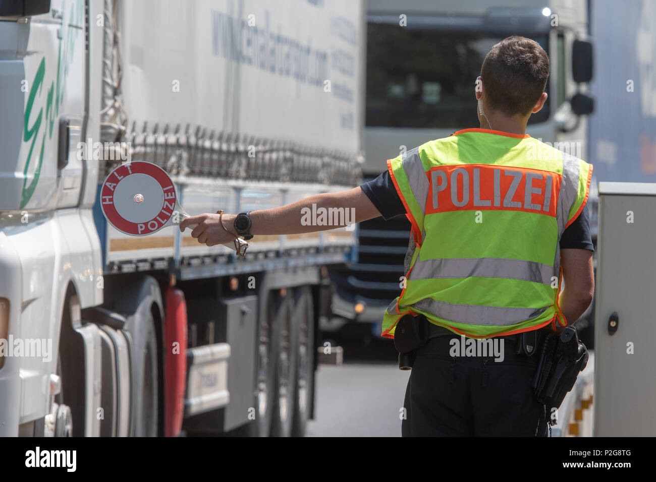 15 June 2018, Germany, Pocking: A German police officer stands at a ...