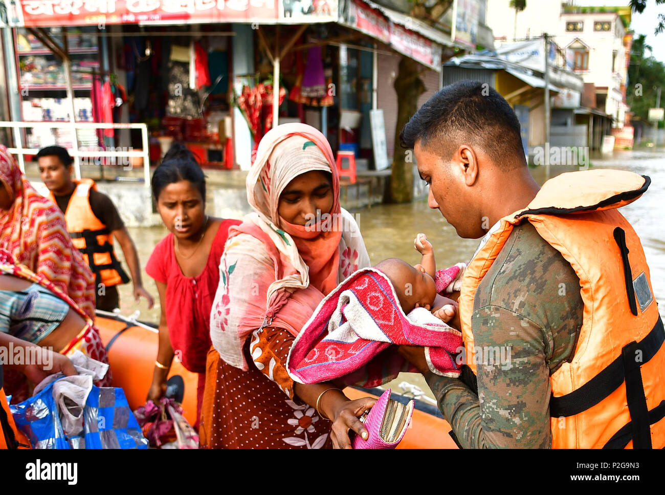 Rescuing women and children hi-res stock photography and images - Alamy