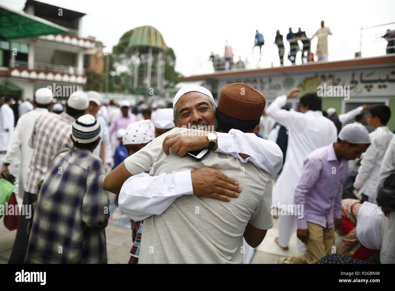 Kathmandu, Nepal. 16th June, 2018. Nepalese Muslims embrace each other ...