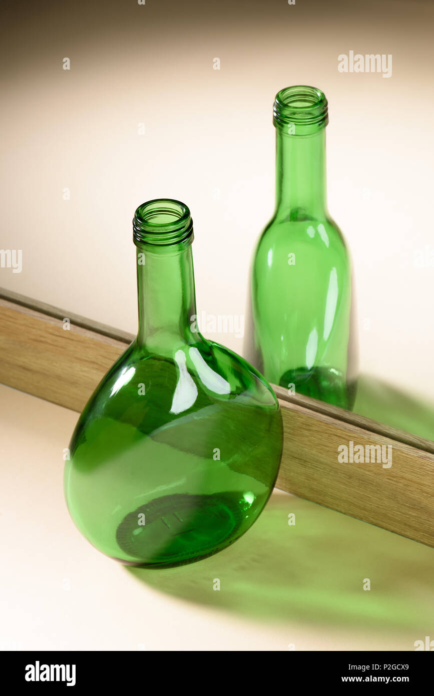 close up view of green glass bottle reflection in mirror Stock Photo ...