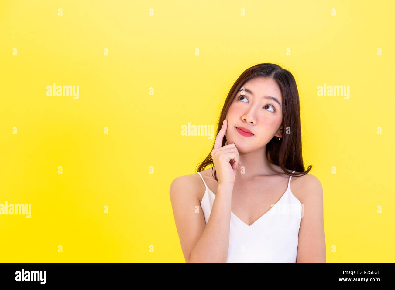 Asian beautiful woman thinking and considering with empty copy space ...