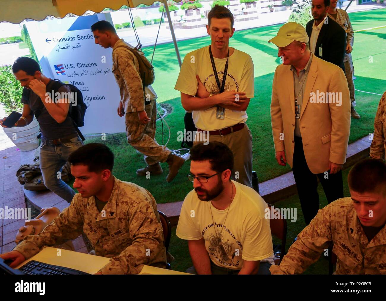 U.S. Ambassador Marc J. Sievers speaks with Consular Chief Sean M ...