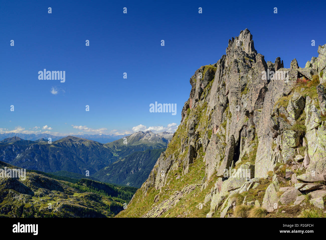 Rock formation in Lagorai range with Latemar range in background, Trans ...